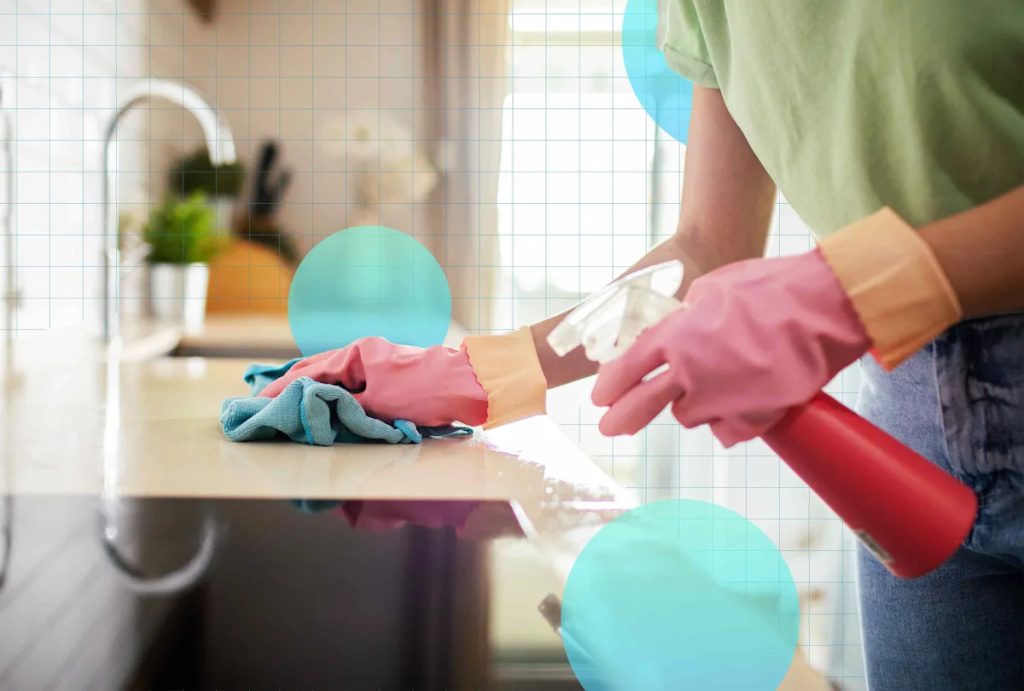 A Food Worker Finishes Cleaning And Sanitizing the Kitchen: Ensuring ...